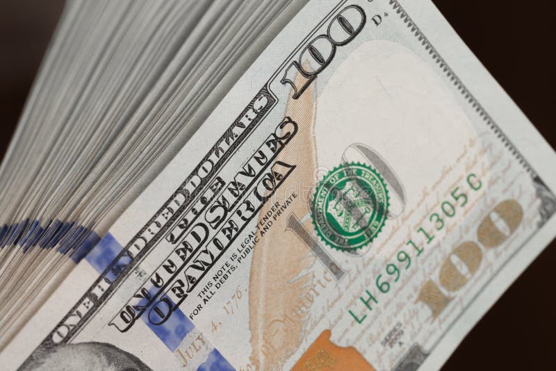 Stack of One Hundred Dollar Bills on a Wooden Table Stock Photo - Image ...