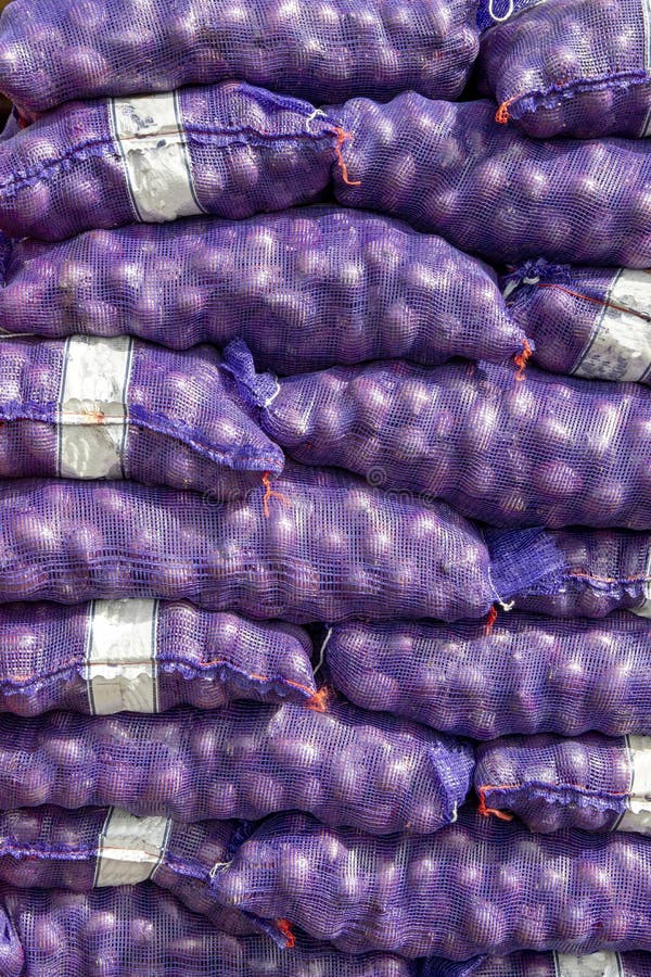 Stack of Onion Bags on Market Stock Image - Image of mediterranean ...