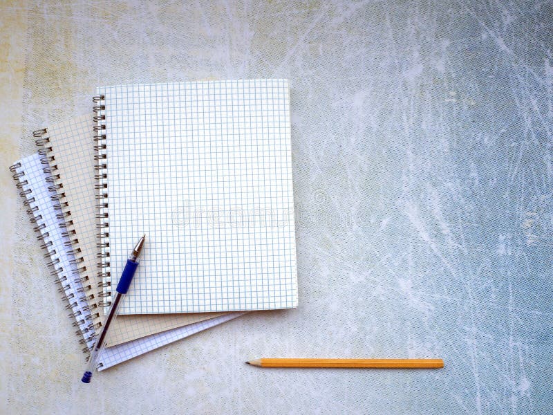 A Stack of Open Notebooks. the Handle is on Top. Pencil at the Bottom ...