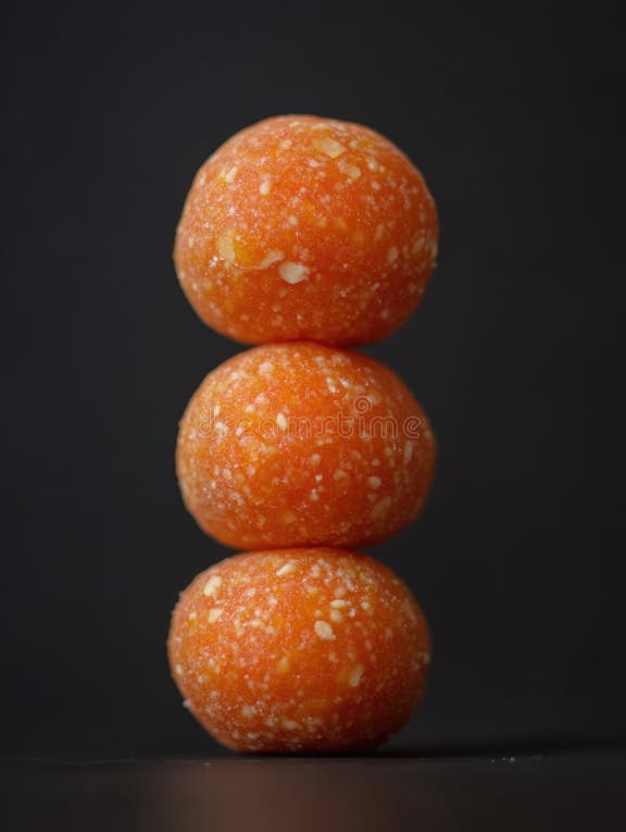 Stack of Orange Candy Orbs stock photo. Image of confection - 359876216