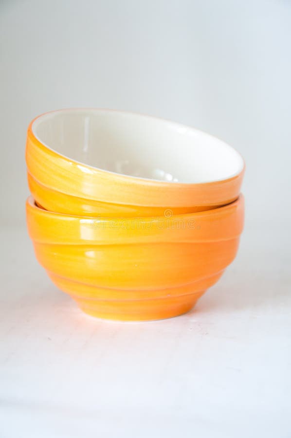 Stack of Orange Ceramic Dishes on White Stock Image - Image of bowl ...