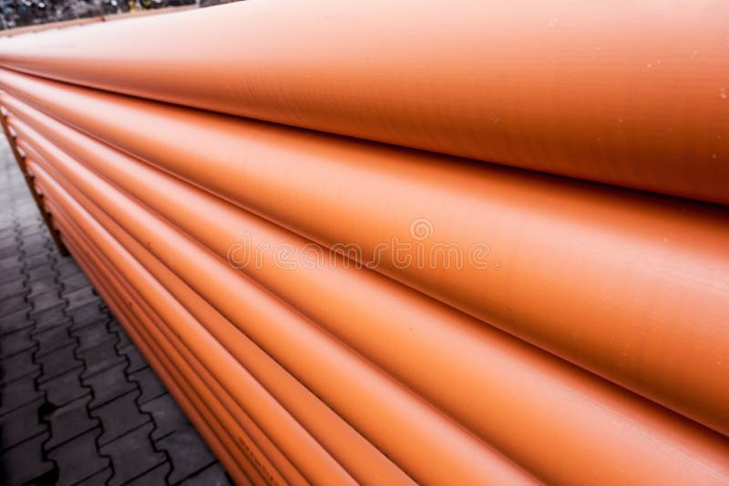 Stack of Orange Pipe Made of Polyvinyl Chloride Stock Photo - Image of ...