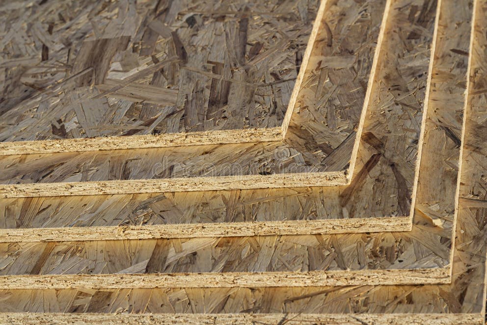 A stack of OSB sheets. stock image. Image of chipboard - 200373279