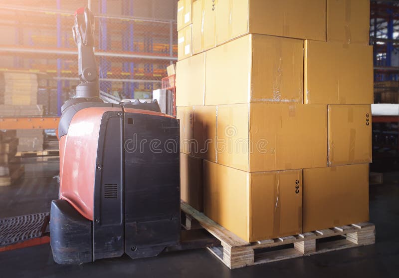 Stack of Package Boxes on Pallet with Electric Forklift Pallet Jack at ...