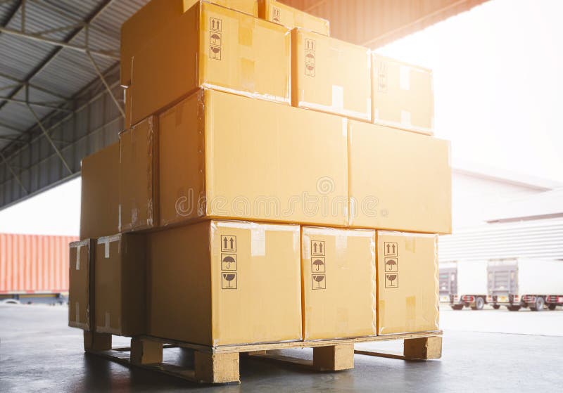 Stack of Package Boxes on Pallet at the Storage Warehouse. Shipping ...