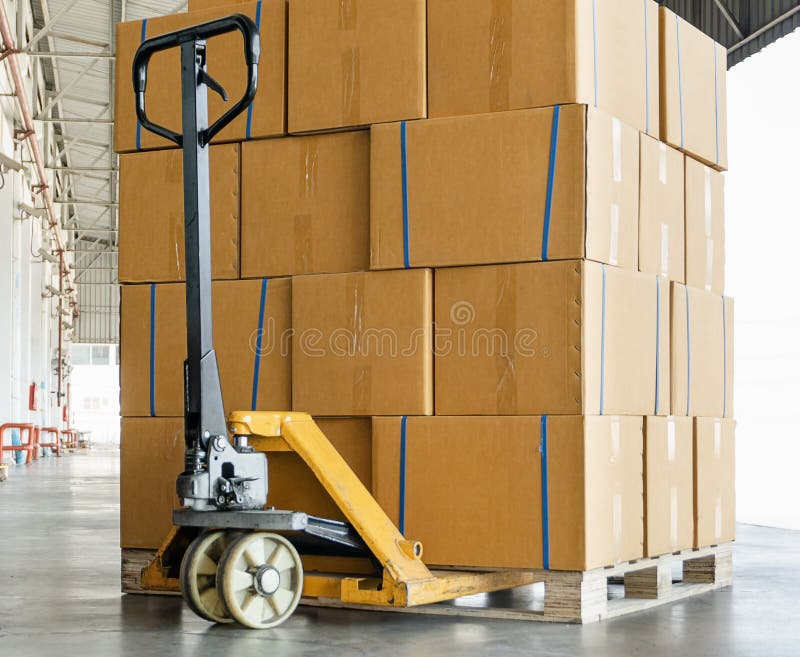 Stack of Package Boxes on Wooden Pallet at Storage Warehouse. Carton ...