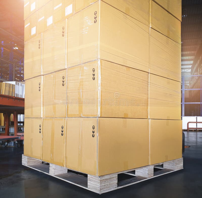 Stack of Package Boxes on Wooden Pallet at Storage Warehouse. Shipment ...