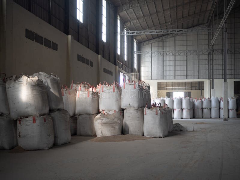 Stack of Paddy Rice in Jumbo Bag in Rice Milling Plant. Agricultural ...