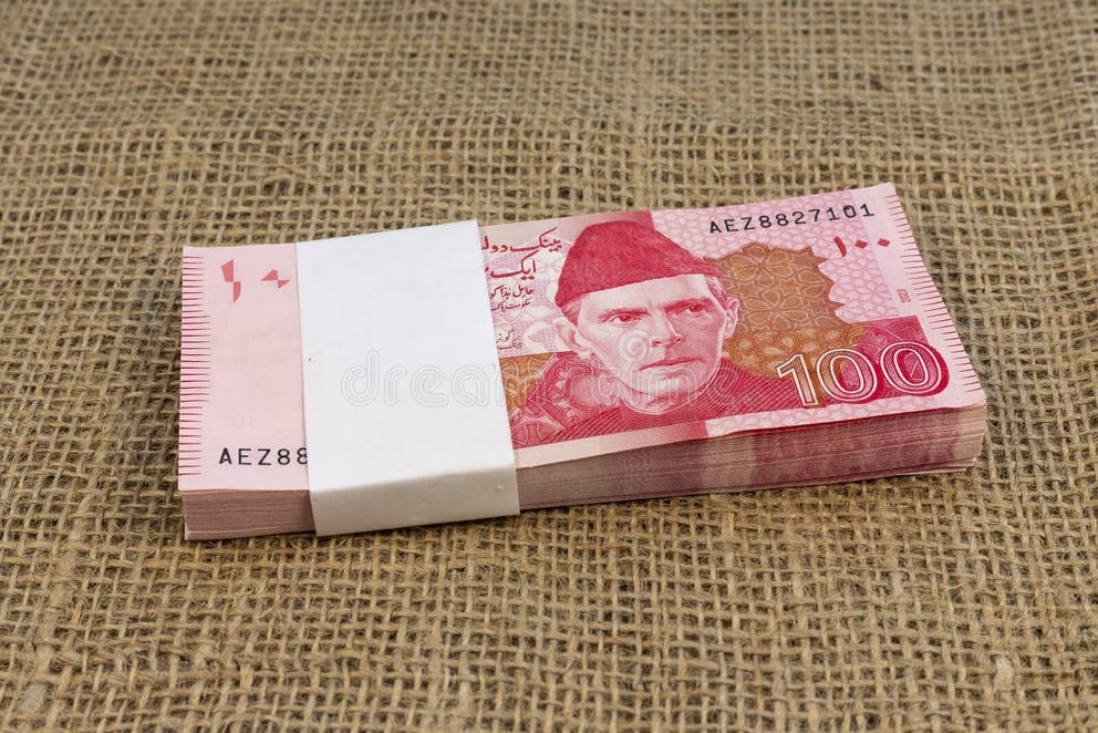 Stack of 100 Pakistani Rupees Banknotes on Burlap Surface Stock Photo ...