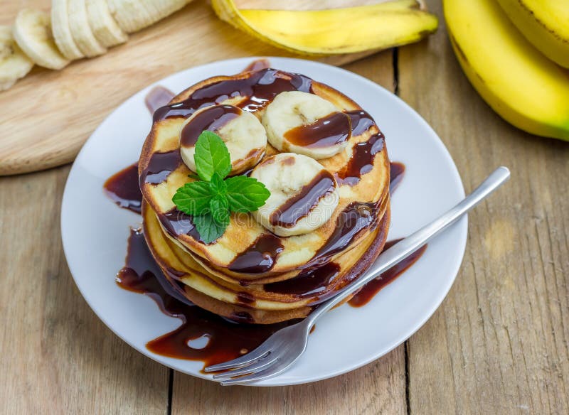 Stack of Pancakes with Banana and Chocolate Syrup Stock Photo - Image ...
