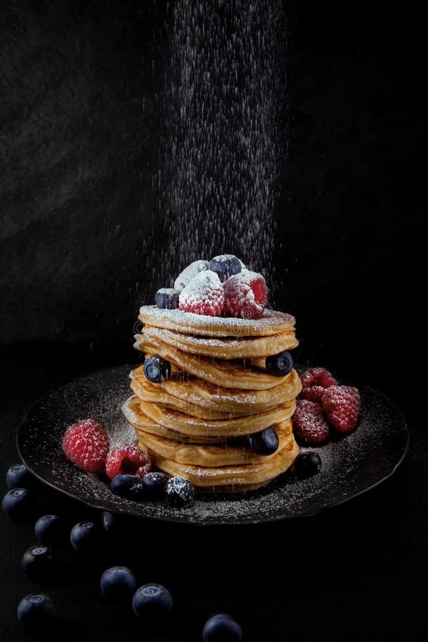 A Stack of Pancakes Decorated with Berries and Powdered Sugar, Rustic ...