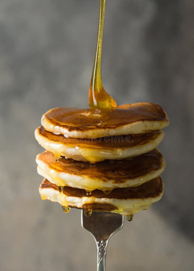 Stack of Pancakes on Fork with Honey. Stock Photo - Image of culinary ...