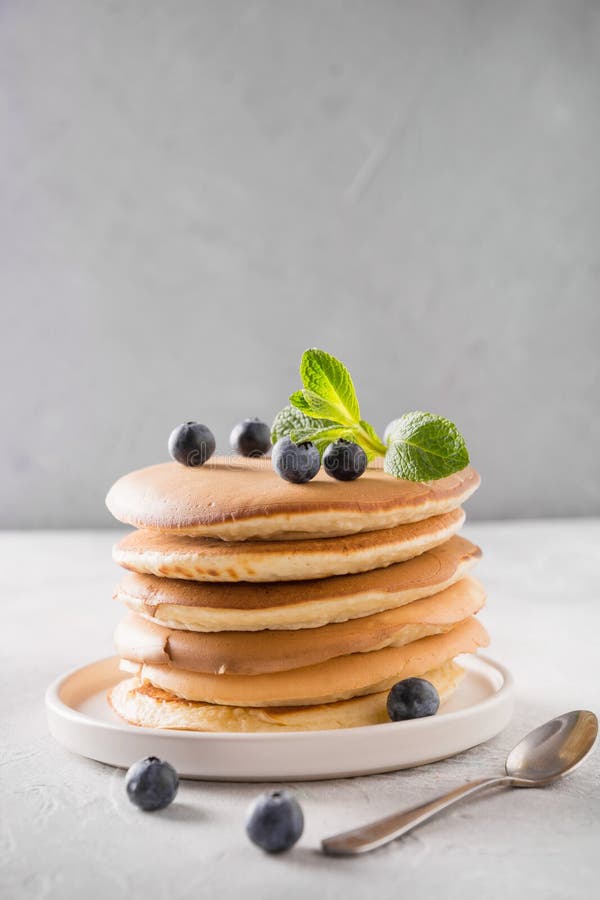 Sweet Homemade Stack of Pancakes with Powered Sugar on Black. Close Up ...