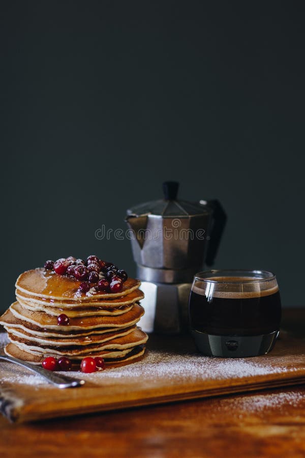 Stack of Pancakes with Maple Syrup and Cranberries and Coffee Stock ... Stack of Pancakes with Maple Syrup and Cranberries and Coffee Stock ...