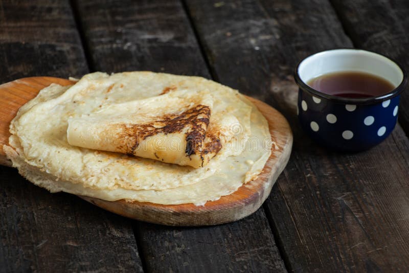 A Stack of Pancakes Next To a Cup of Coffee on a Wooden Old Table ...