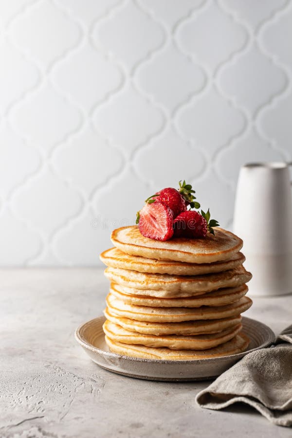 Stack of Pancakes with Strawberries with Napkin on Textured Background ...