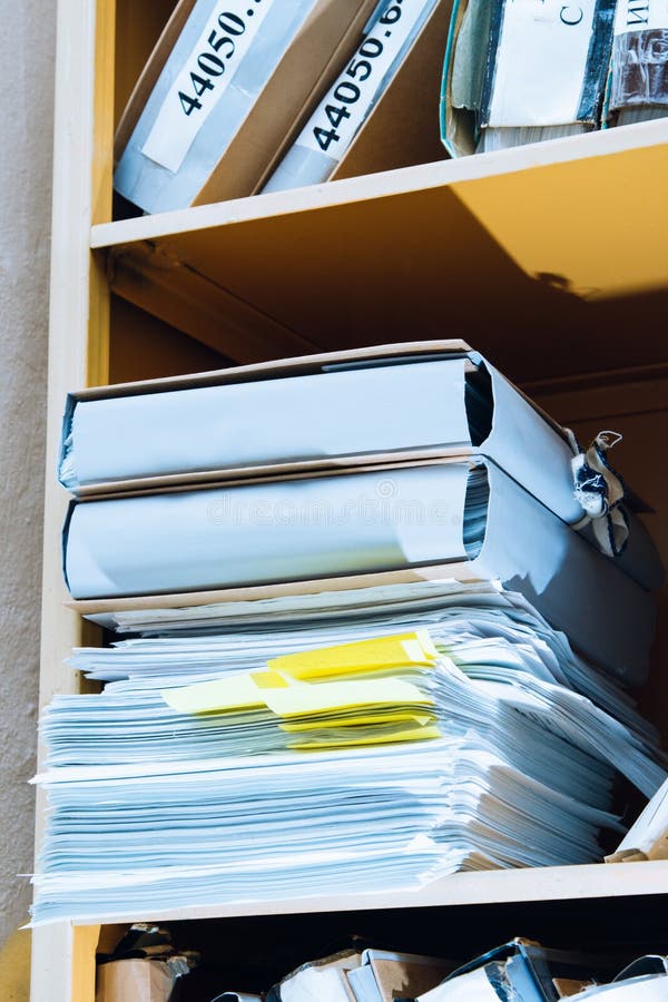 Stack of paper in bookcase stock image. Image of order - 43899655