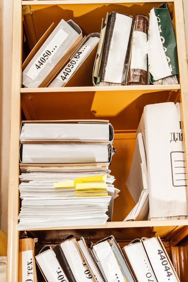 Stack of paper in bookcase stock photo. Image of order - 43899712