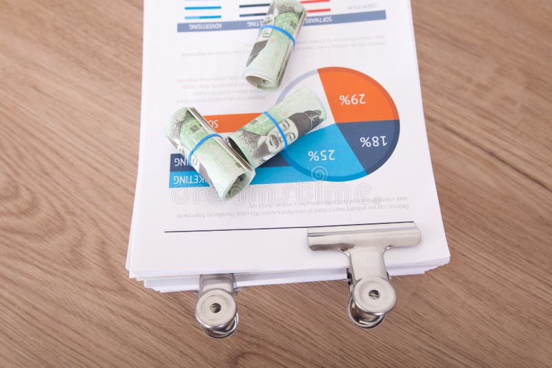 A Stack of Paper Business Documents and Several Rolls of Korean Won ...