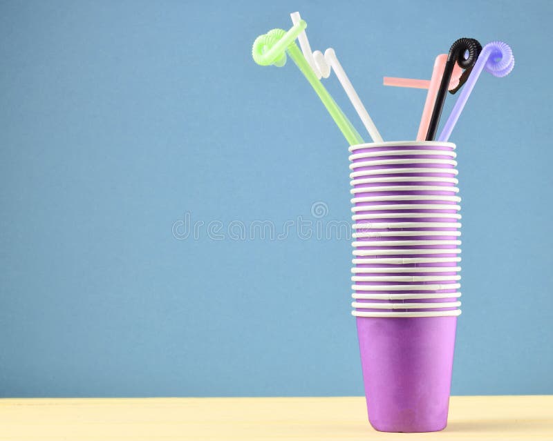A Stack Of Paper Cups With Cocktail Tubes Stock Image - Image of ...