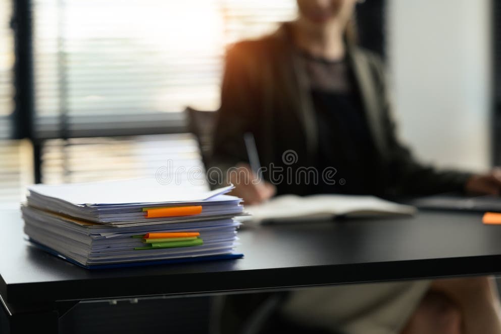 Stack of Paper Files with Colorful Sticky Notes on Office Desk ...