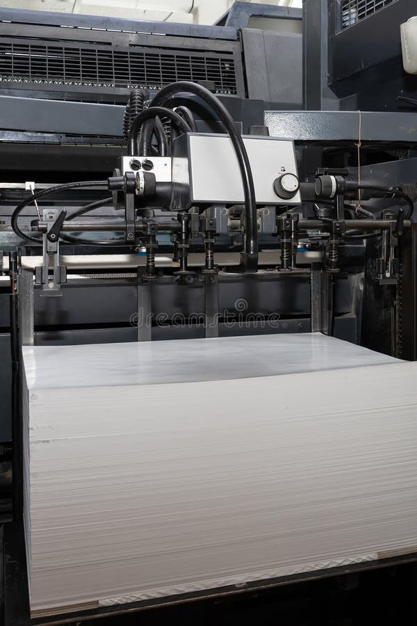 A Stack of Paper is Loaded into a Typewriter Stock Photo - Image of ...