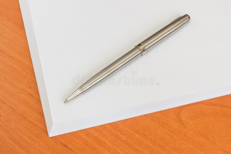 Stack of Paper and Pen on a Table Stock Image - Image of closeup, form ...