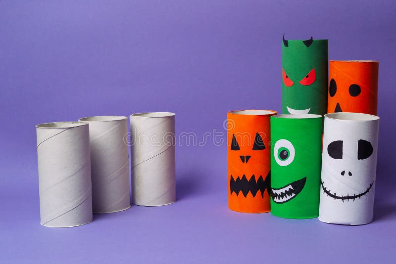Stack of Paper Rolls with Halloween Faces Drawn on Them Stock Image ...
