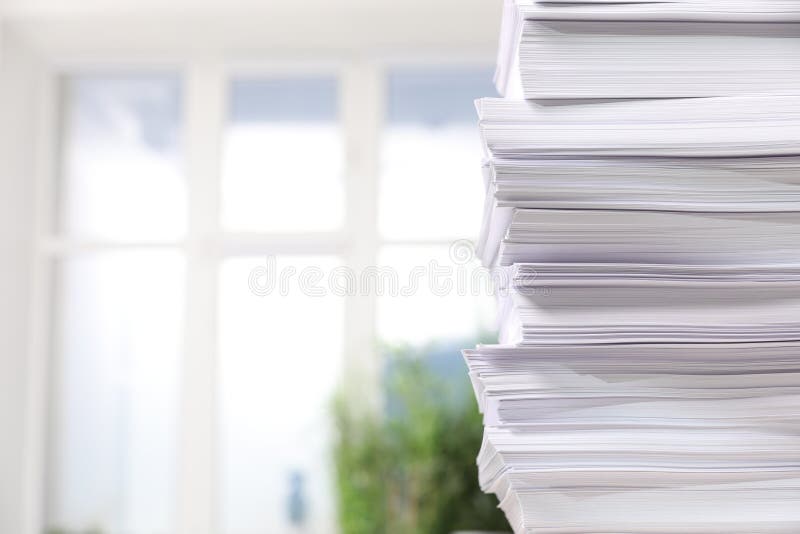 Stack of Paper Sheets Against Blurred Background, Closeup. Space for ...