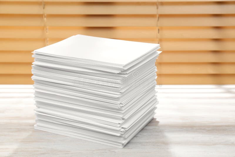 Stack of Paper Sheets on White Wooden Table Stock Photo - Image of ...