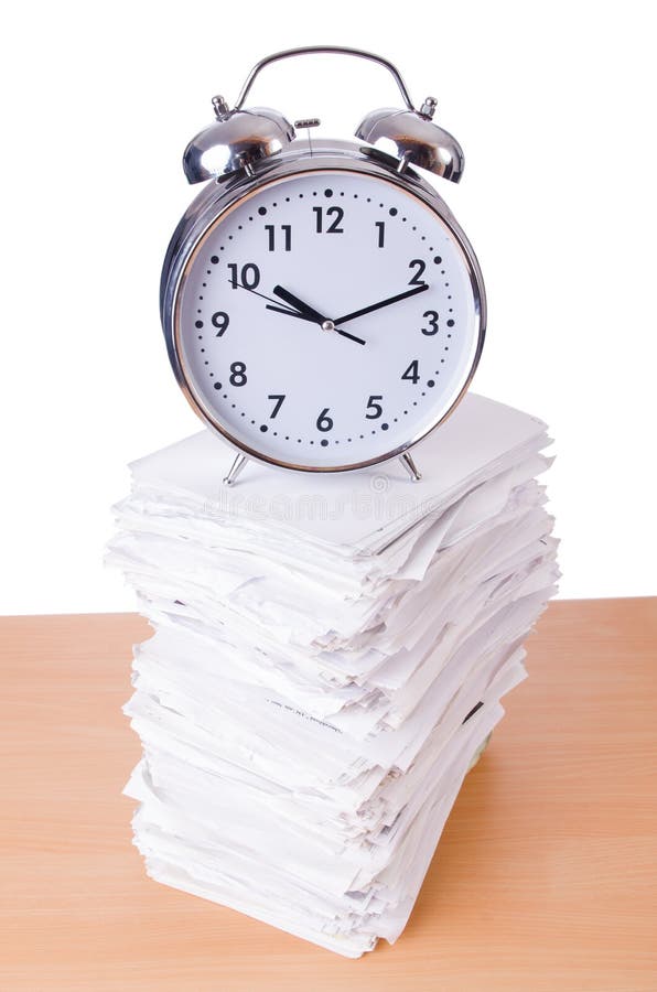 Stack of papers and clock stock photo. Image of papers - 44321382