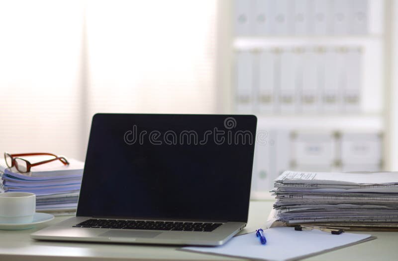 A Stack of Papers on the Desk with a Computer Stock Image - Image of ...