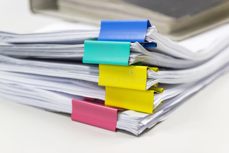 Stack of Papers Documents in Archives Files with Paper Clips on Desk at ...