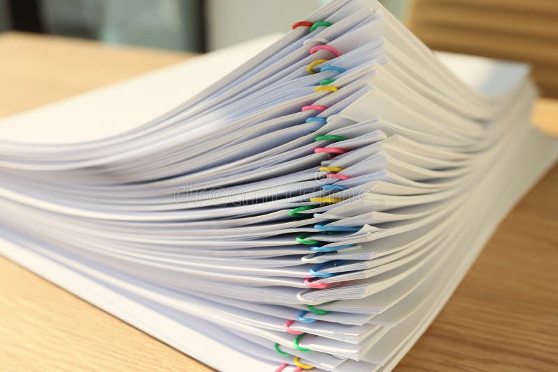 Stack of Papers Fastened with Pins Lies on Wooden Table Stock Photo ...