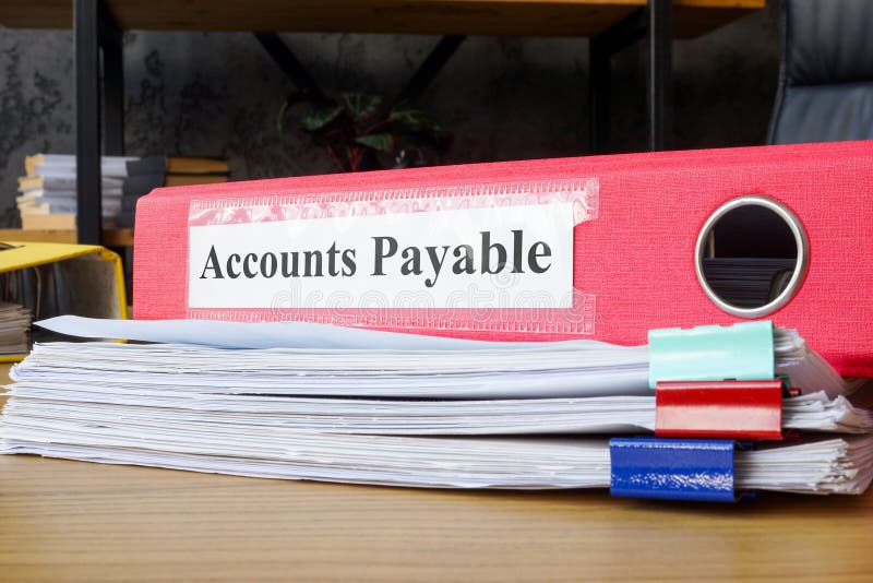 Stack of Papers and Folder Labeled Accounts Payable. Financial ...