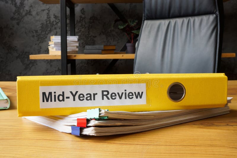Stack of Papers and Folder with Mid-year Review. Stock Photo - Image of ...
