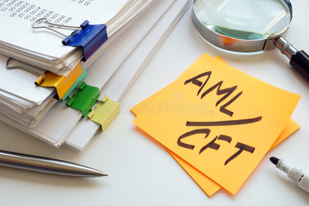 Stack of Papers, Magnifying Glass and Abbreviation AML CFT Anti-money ...