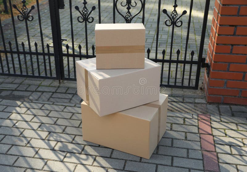 Stack of Parcels Delivered Near Front Gates Stock Image - Image of ...