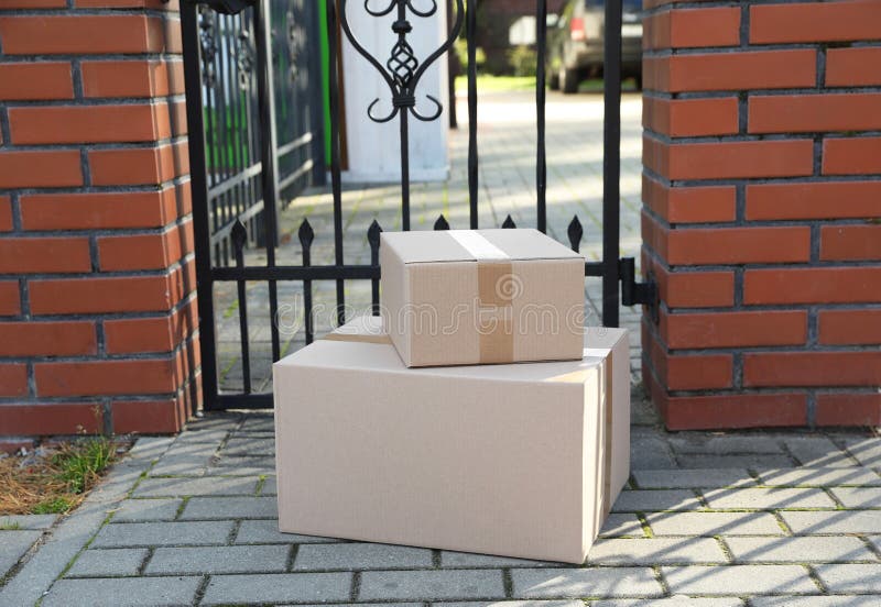 Stack of Parcels Delivered Near Front Gates Stock Image - Image of ...