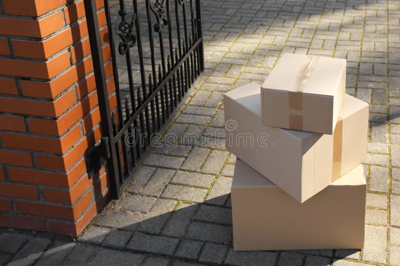 Stack of Parcels Delivered Near Front Gates Stock Image - Image of ...