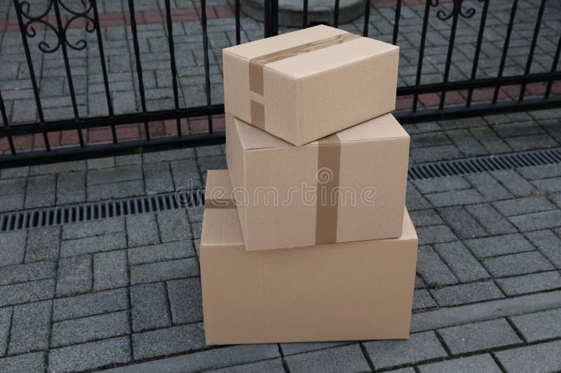 Stack of Parcels Delivered Near Front Gates Stock Photo - Image of pack ...