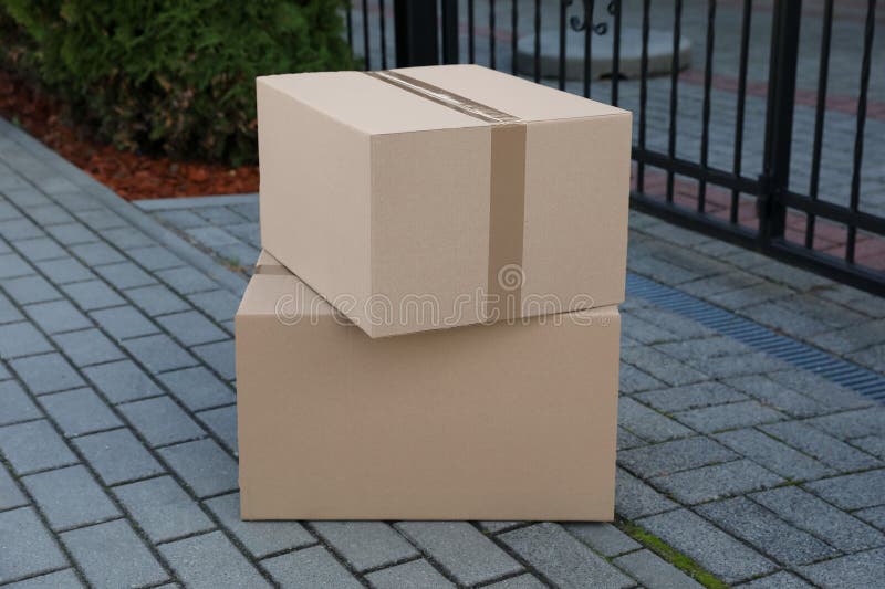 Stack of Parcels Delivered Near Front Gates Stock Photo - Image of ...
