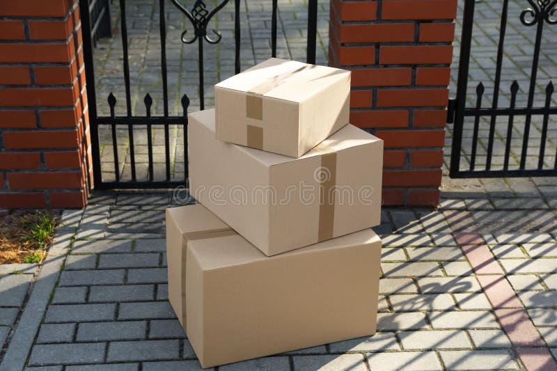 Stack of Parcels Delivered Near Front Gates Stock Image - Image of ...