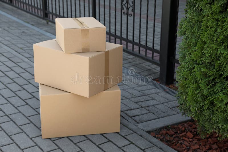 Stack of Parcels Delivered Near Front Gates Stock Image - Image of ...