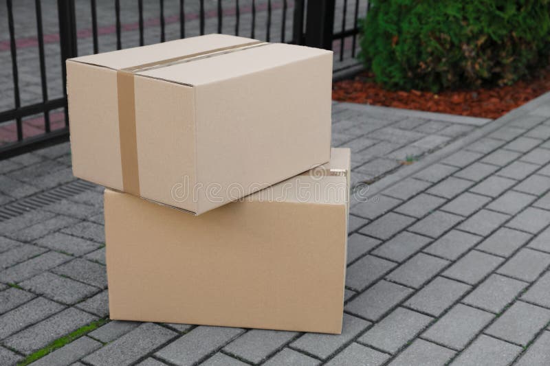 Stack of Parcels Delivered Near Front Gates Stock Photo - Image of home ...