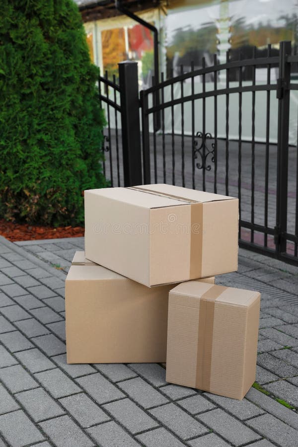 Stack of Parcels Delivered Near Front Gates Stock Image - Image of ...