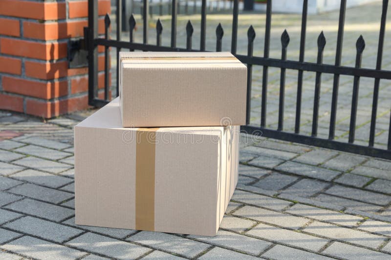 Stack of Parcels Delivered Near Front Gates Stock Image - Image of ...