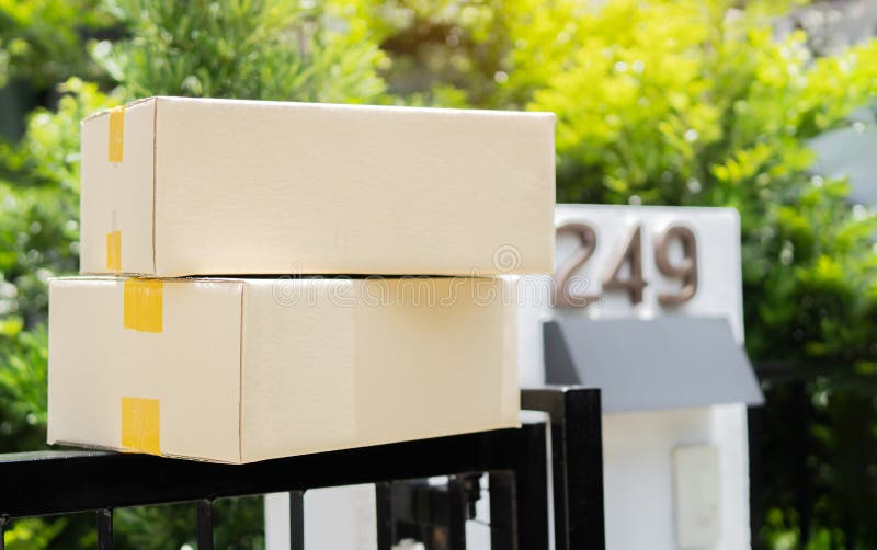 Stack of Parcels Delivered Near Front Gates, Two Carton Boxes Delivered ...