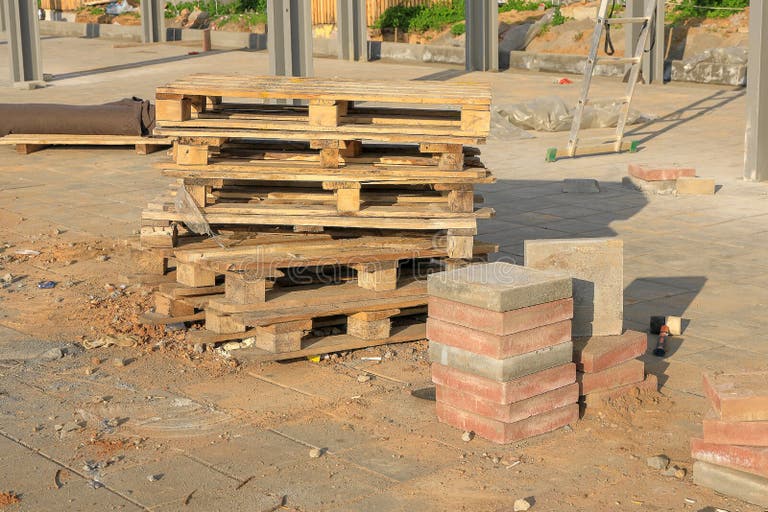 A Stack of Paving Slabs and Wooden Pallets from it Stock Image - Image ...