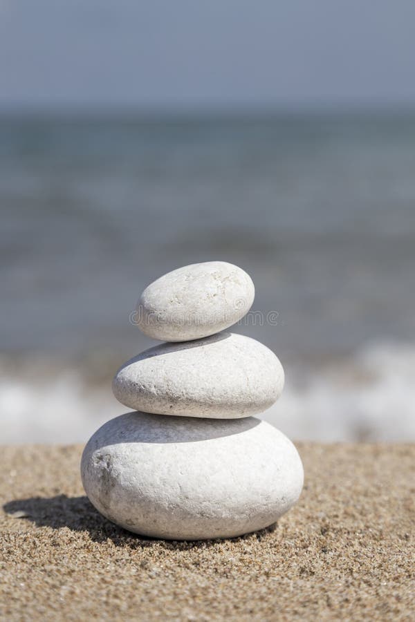 Stack of Pebble Stones on Balance on Sand Stock Photo - Image of ...